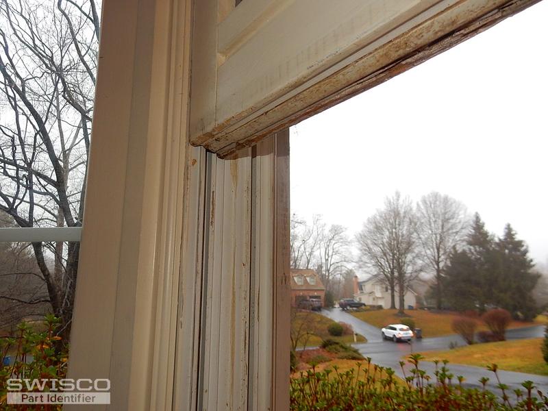 Double hung window inserted side plastic guides with spring inside ...
