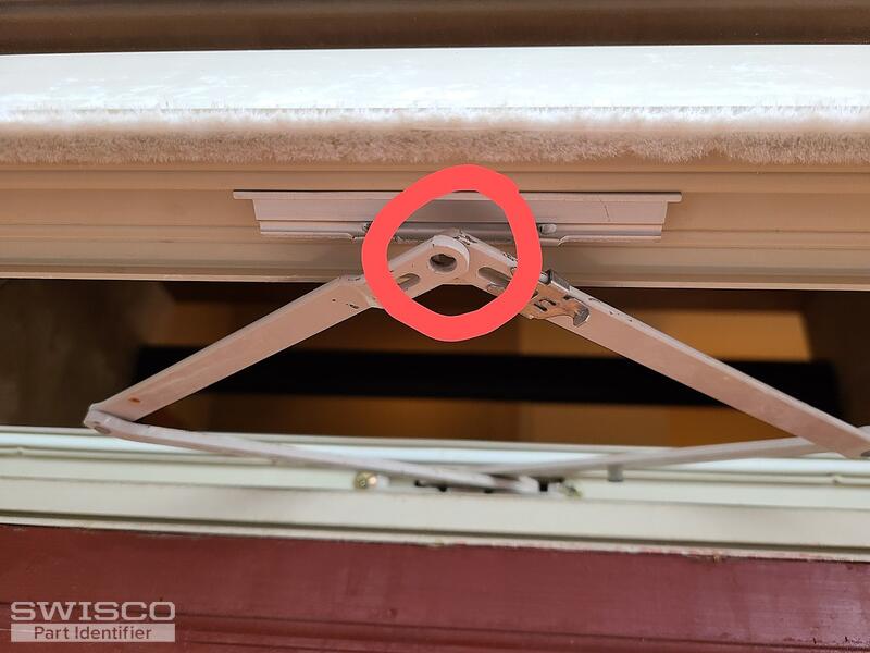 Part missing that attaches arm to window on window closing mechanism ...