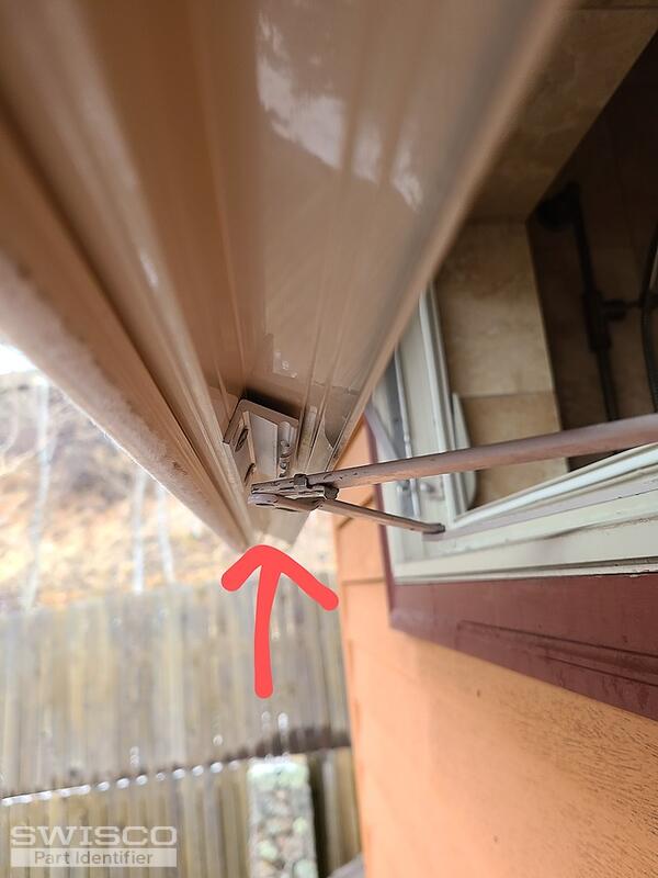 Part missing that attaches arm to window on window closing mechanism ...