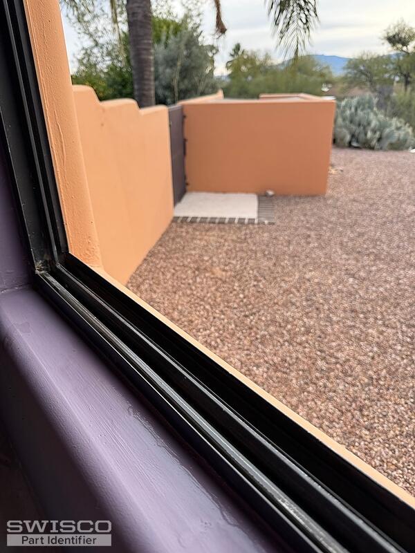 This is a "vinyl" insert that holds the bottom of the screen in place ...