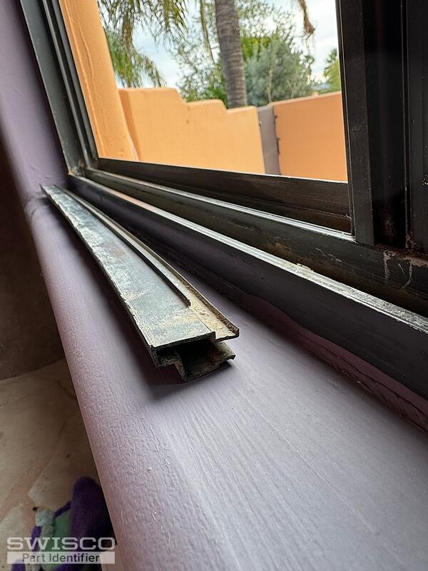 This is a "vinyl" insert that holds the bottom of the screen in place ...