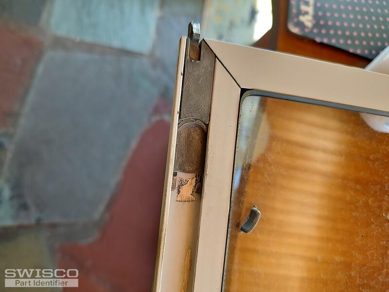 Pella storm door latch that releases the glass to slide up and down ...